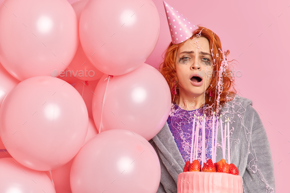 Photo of sleepy ginger woman tired after party and birthday celebration ...