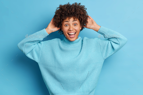 Beautiful joyful dark skinned woman has overjoyed face expression ...