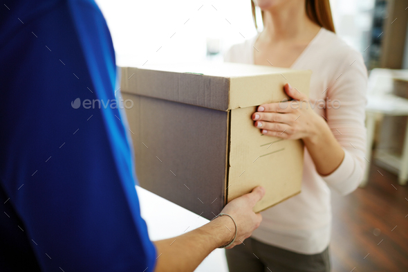 Receiving a parcel Stock Photo by Pressmaster | PhotoDune
