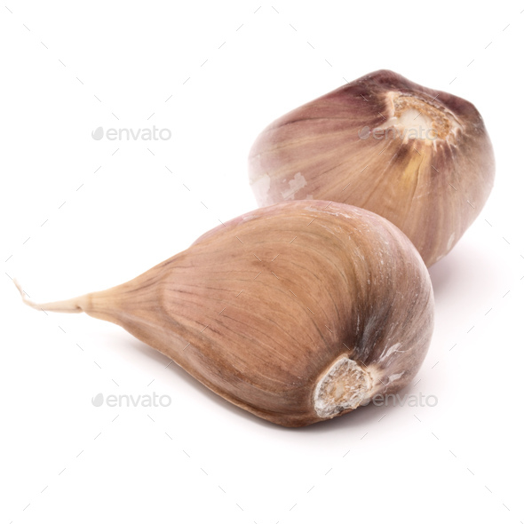 Two garlic cloves isolated on white background cutout Stock Photo by natika