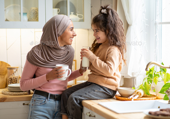 Happy Muslim Mom In Hijab And Little Daughter Bonding Together In ...