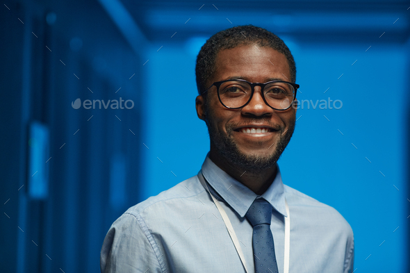 Smiling African American Network Engineer Stock Photo by seventyfourimages