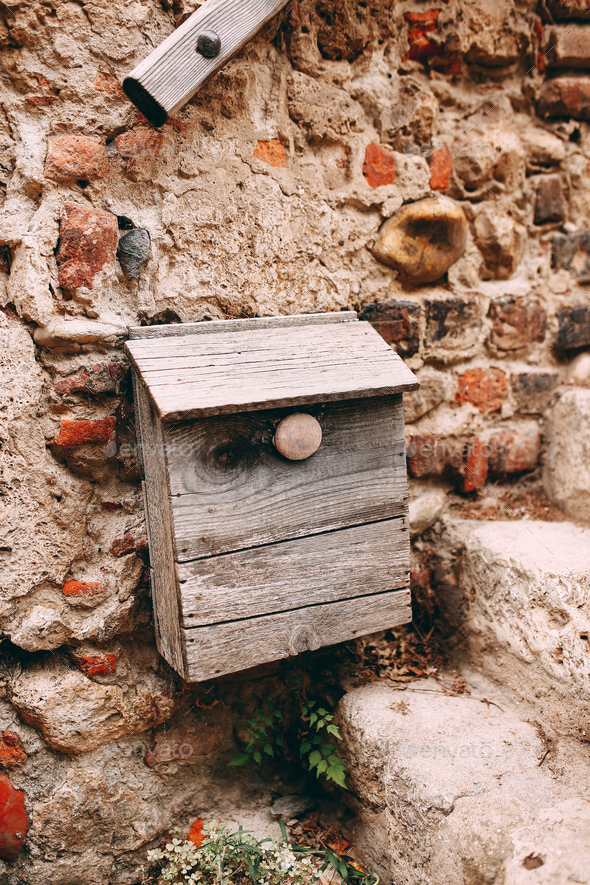Old wooden post box on stone wall in Perouges, France Stock Photo by ...