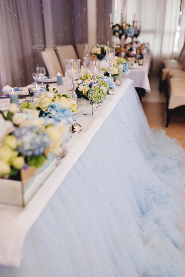 Wedding table with decorations in sky blue color Stock Photo by LenorIv
