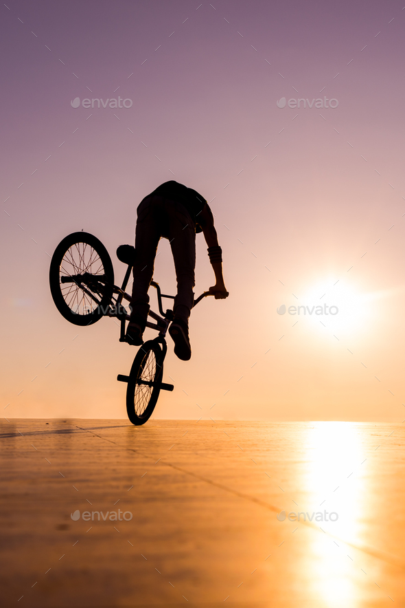 BMX rider at sunset Stock Photo by Netfalls | PhotoDune