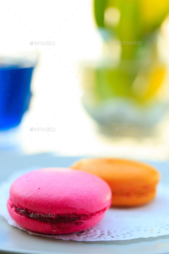 macarons on white paper Stock Photo by Netfalls | PhotoDune