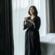 Women wearing black robes, handing coffee in the bedroom. Stock Photo ...