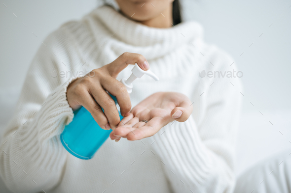 Young women wash hands with handwashing gel. Stock Photo by Johnstocker