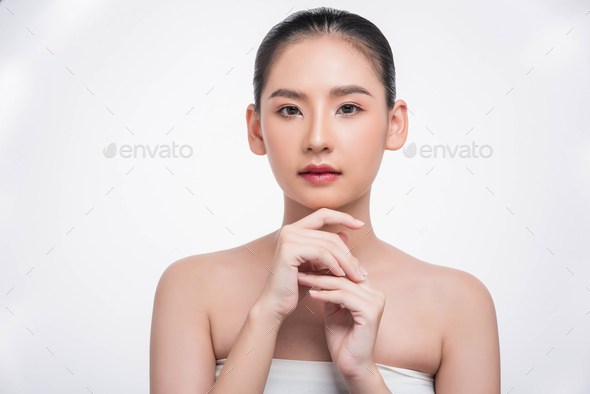 Woman using the finger to touch the chin. Stock Photo by Johnstocker