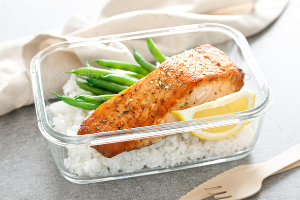 Lunch box containers with grilled salmon fish fillet, rice and green ...