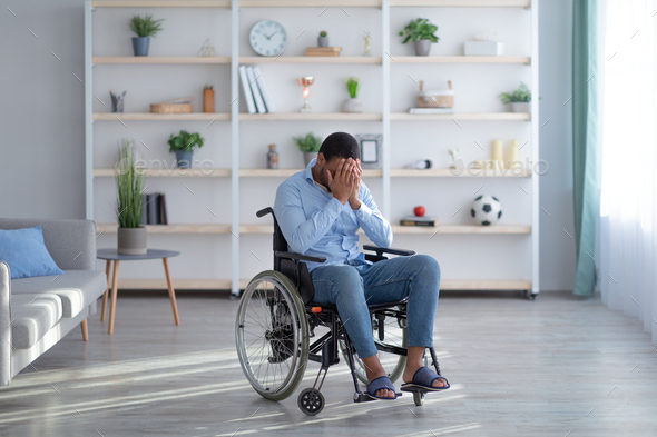 Depression and loneliness in disabled adults. Young black guy in ...