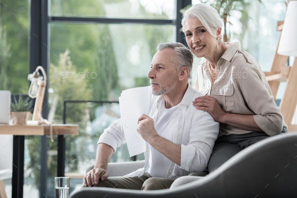 Happy senior colleagues at modern office Stock Photo by LightFieldStudios
