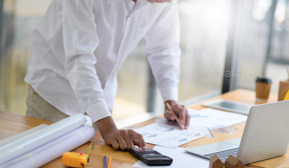 Architects used a calculator to calculate the scale of the house plan ...