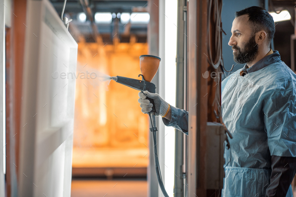 Powder coating process of metal products Stock Photo by RossHelen ...