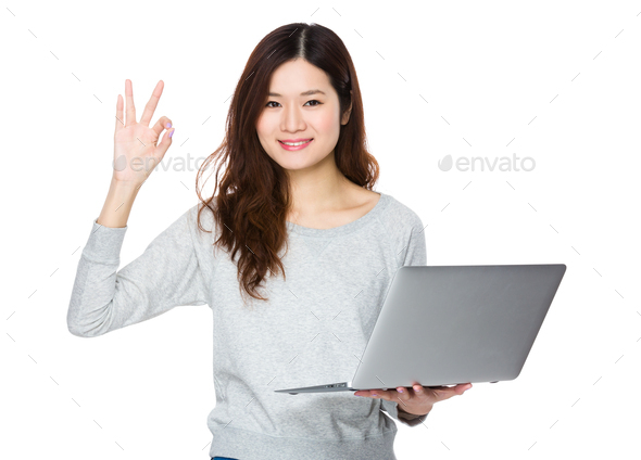 Asian Young Woman hold with laptop computer and ok sign Stock Photo by ...