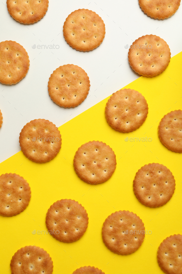 Flat lay with cracker biscuits on two tone background Stock Photo by ...