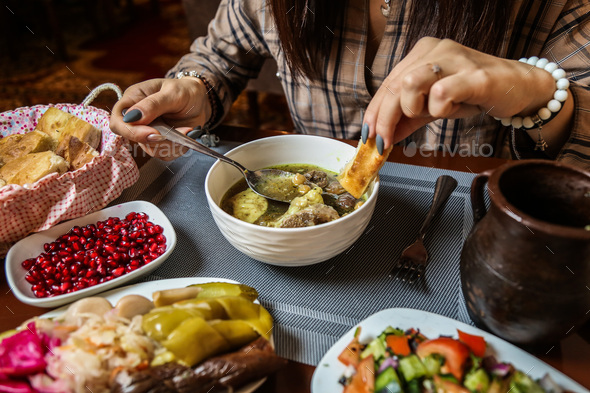 traditional piti soup with lamb meat and vegetables and side snacks top ...