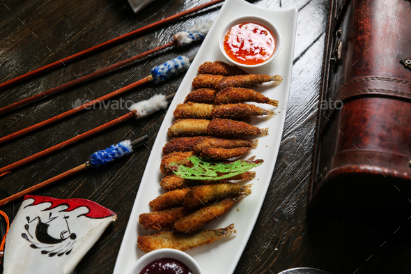 pan-fried splat fish crackers sweet chili side view Stock Photo by ...