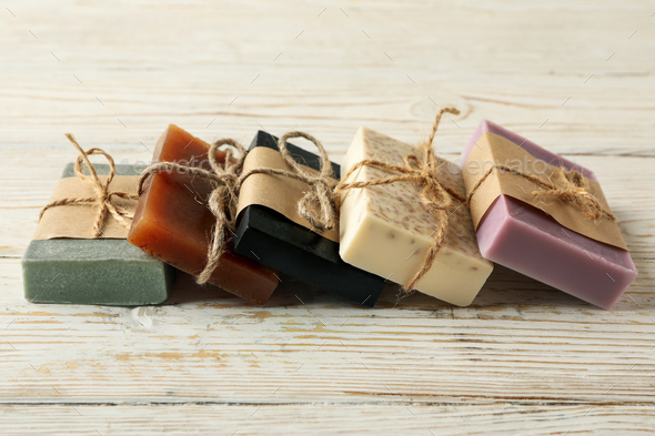 Pieces of natural handmade soap on wooden background Stock Photo by ...