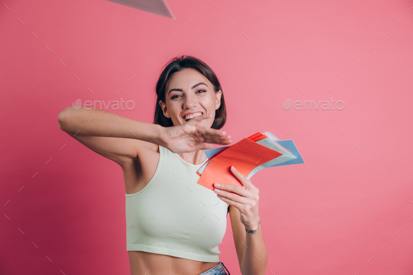 Women on pink background pretty funny throwing letters in air Stock ...