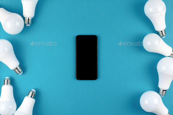 LED light bulbs and modern smartphone mockup Stock Photo by nzooo ...