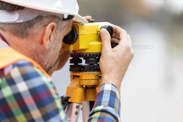 Geodesists using tachometer Stock Photo by bialasiewicz | PhotoDune