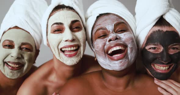 Multi generational women having fun wearing facial beauty mask - Skin ...