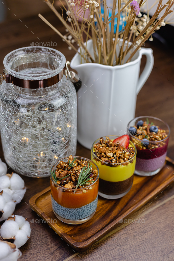 Colorful healthy breakfast sweet deserts few different chia puddings in ...