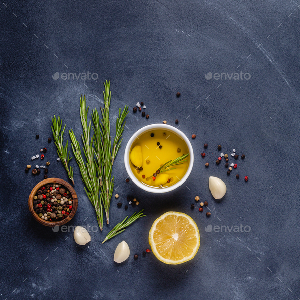 Herbs and condiments on black stone background. Stock Photo by tatiana ...