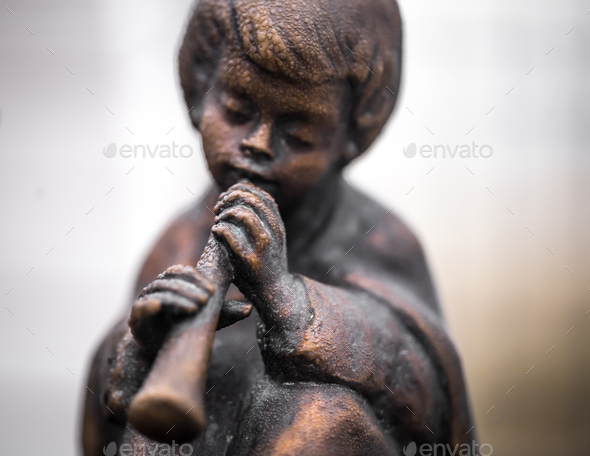 Statues of children playing musical instruments Stock Photo by puhimec