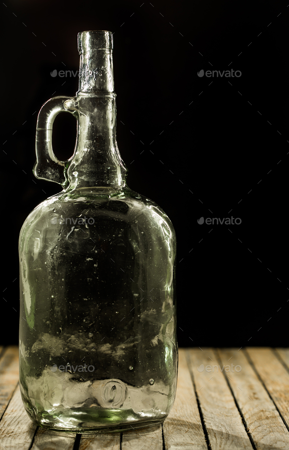 blank, original, glass bottle on a black background Stock Photo by puhimec