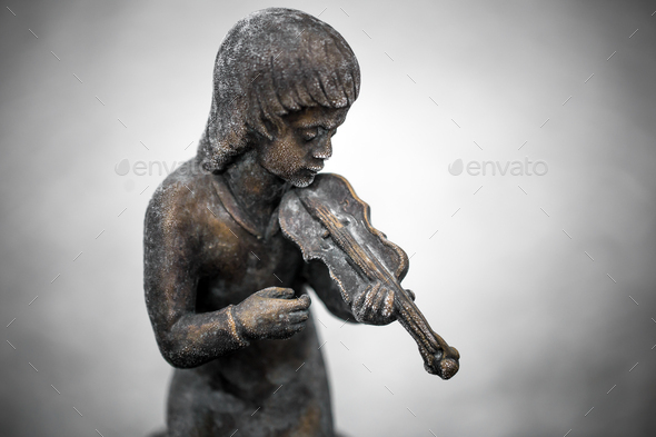 Statues of children playing musical instruments Stock Photo by puhimec
