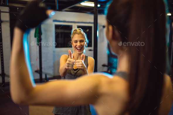 Young girl is happy to see progress that her friend has made by doing ...