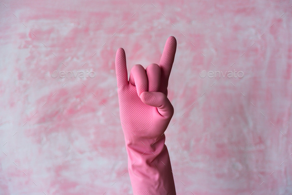 Pink left hand rock gesture on pink Stock Photo by molenira | PhotoDune