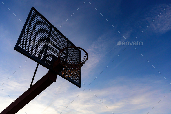 Basketball hoop on sunset sky Stock Photo by molenira | PhotoDune