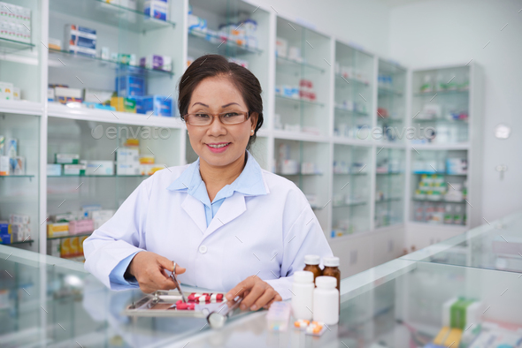 Working with medications Stock Photo by DragonImages | PhotoDune