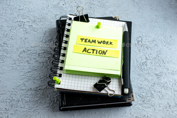front view teamwork and action note on copybook on light background ...