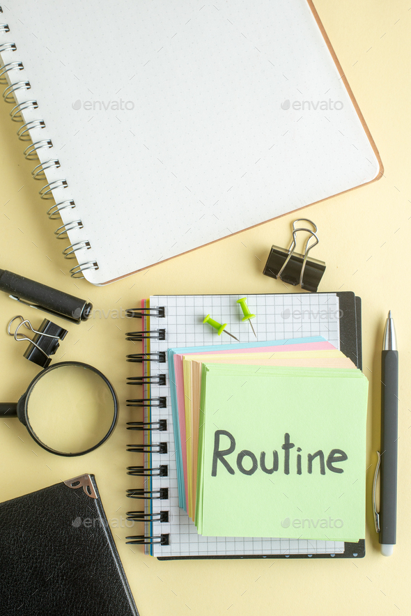 top view routine written note along with colorful little paper notes on ...