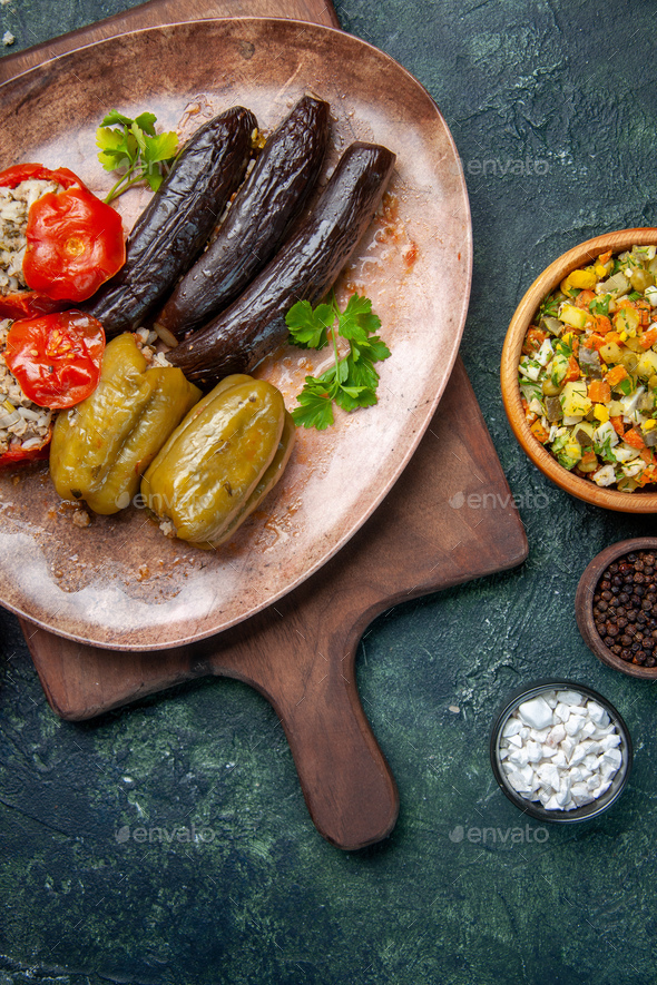 top view tasty vegetable dolma with salad on dark blue background meal ...