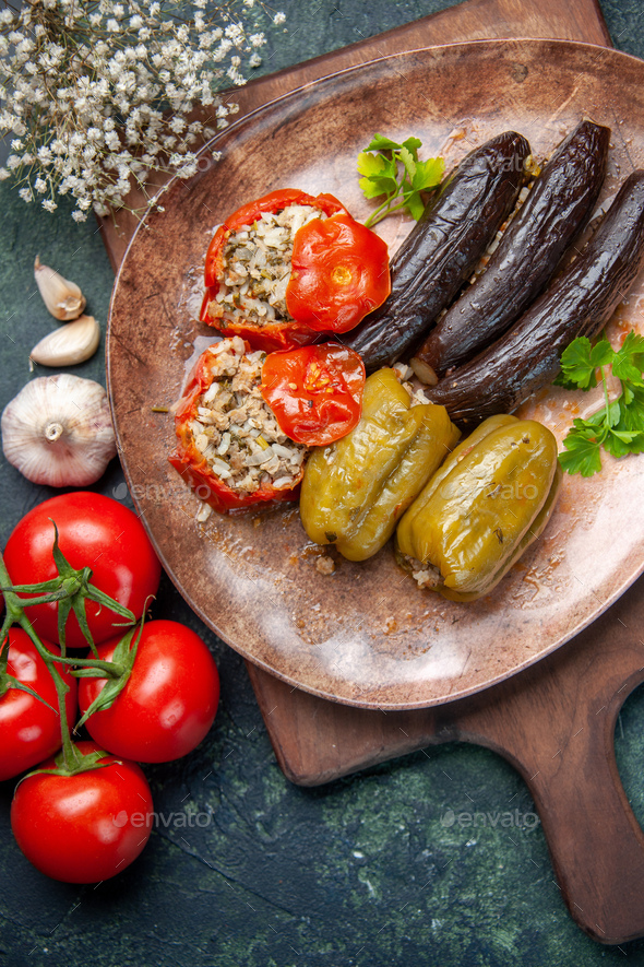 top view tasty vegetable dolma with salad on dark blue background ...