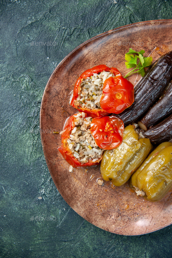 top view delicious vegetable dolma meal filled with ground meat on blue ...