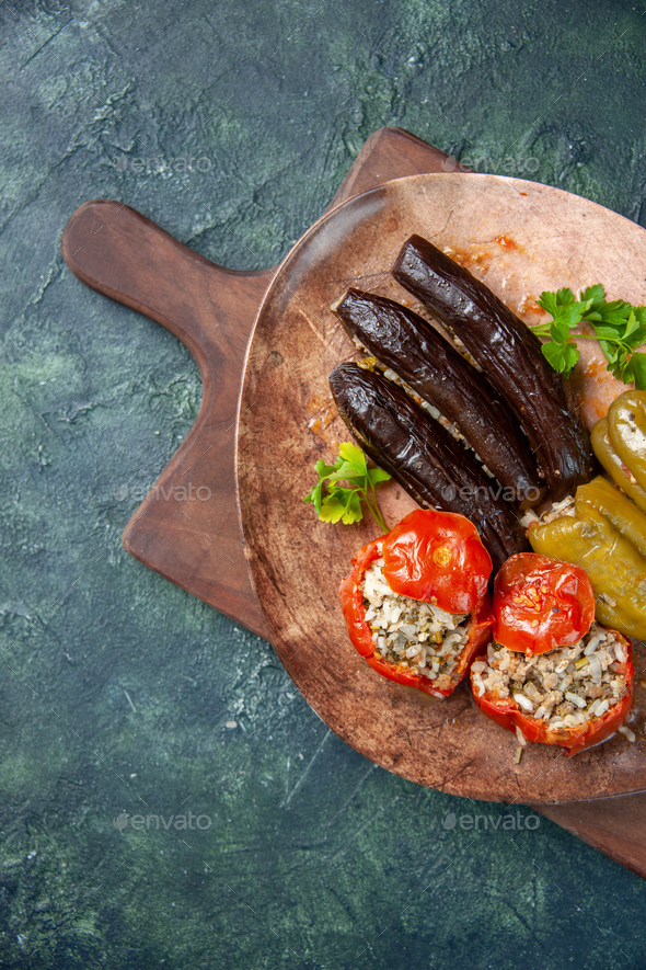 top view tasty vegetable dolma inside plate on dark blue background ...