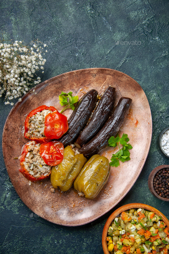 top view delicious vegetable dolma meal filled with ground meat on blue ...