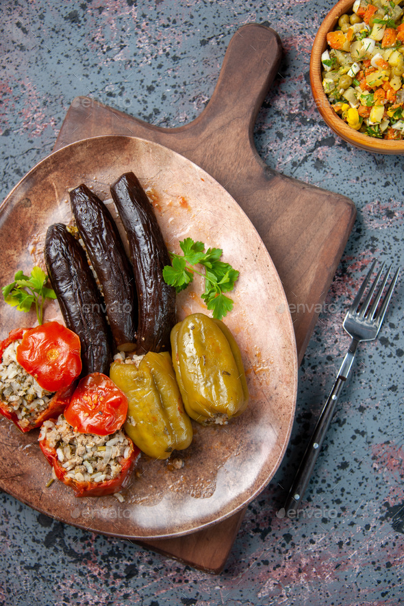 top view delicious vegetable dolma with salad on blue background food ...
