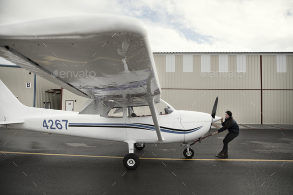 Aviation engineer checking a propeller plane Stock Photo by Rawpixel
