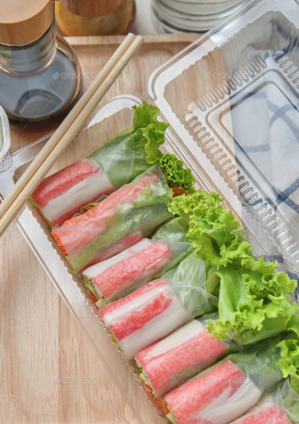 The fresh spring rolls in the plastic container Stock Photo by Studio_OMG