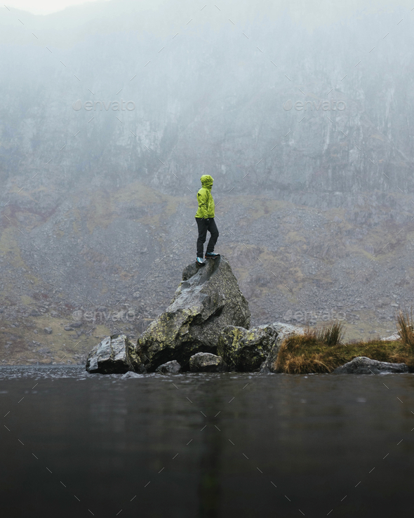 Standing on the rock Stock Photo by Rawpixel | PhotoDune