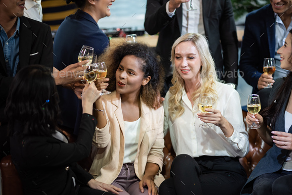 Toast to success. Group of business people toasting with champagne ...
