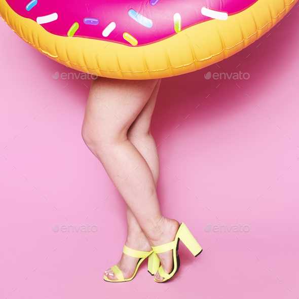 Woman wearing a swimsuit with an inflatable swim ring Stock Photo by ...