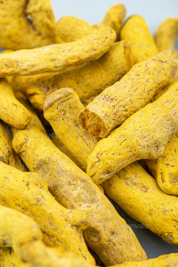 side view of dry turmeric roots on white background Stock Photo by ...